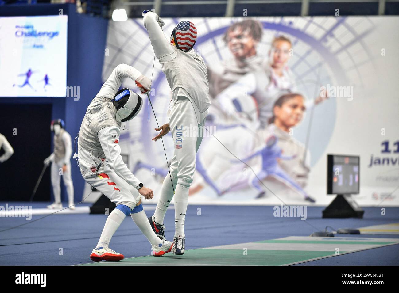 USA foilist MILES CHAMLEY-WATSON (R) competes against China's foilist ...
