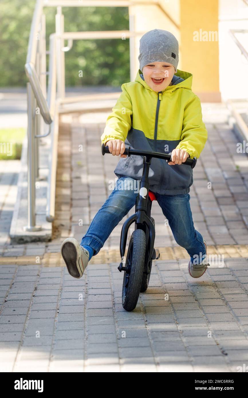 Toddler child dreaming and having fun on warm spring day. outdoors games for children. Balance ...