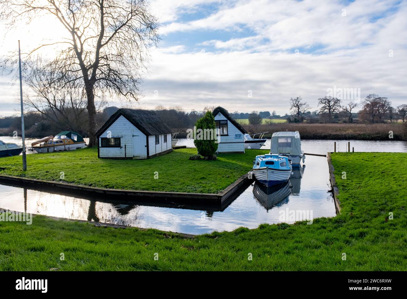 Coltishall, Norfolk, UK – January 13 2024. Boats moored near a wooden ...