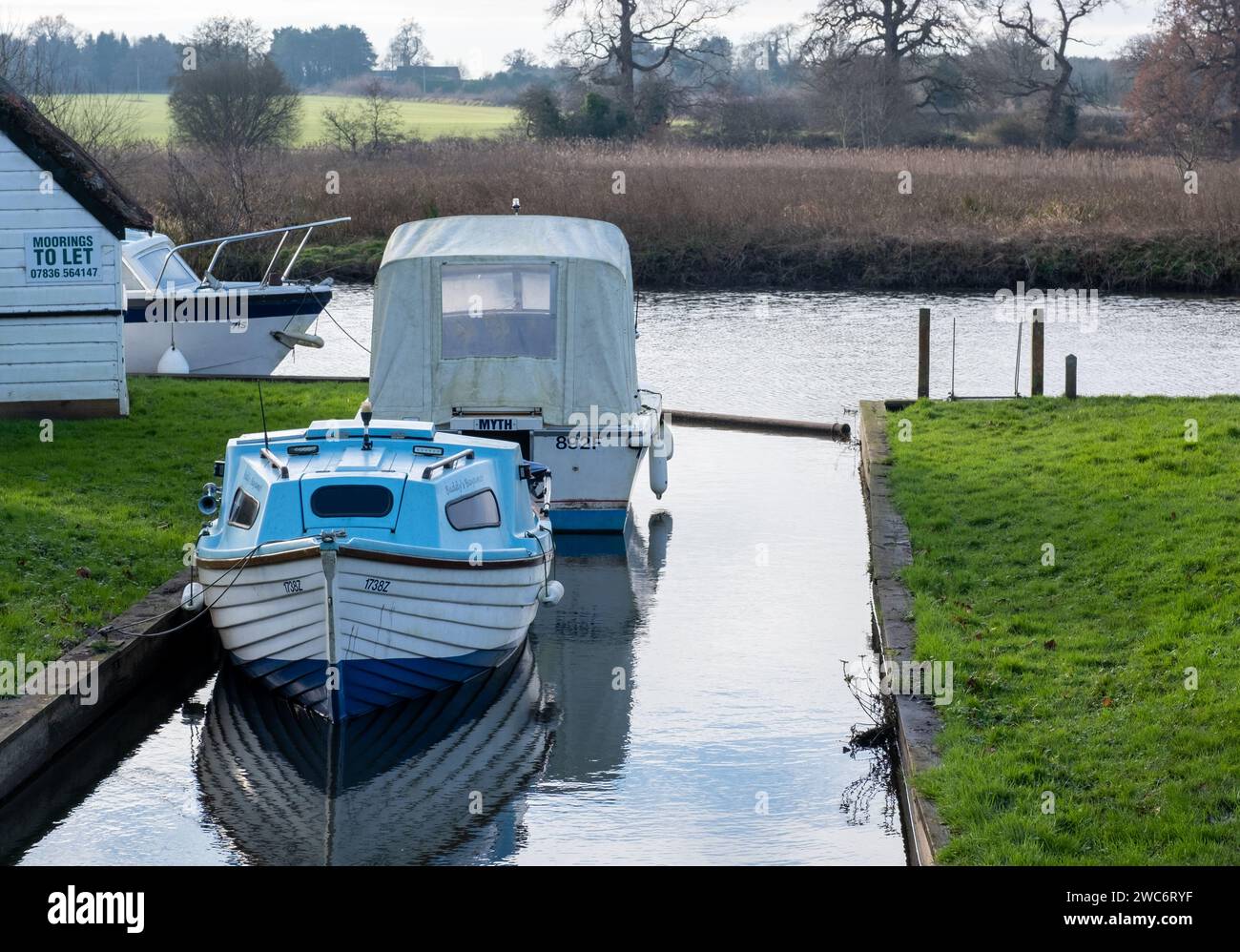 Coltishall, Norfolk, UK – January 13 2024. Boats moored near a wooden ...