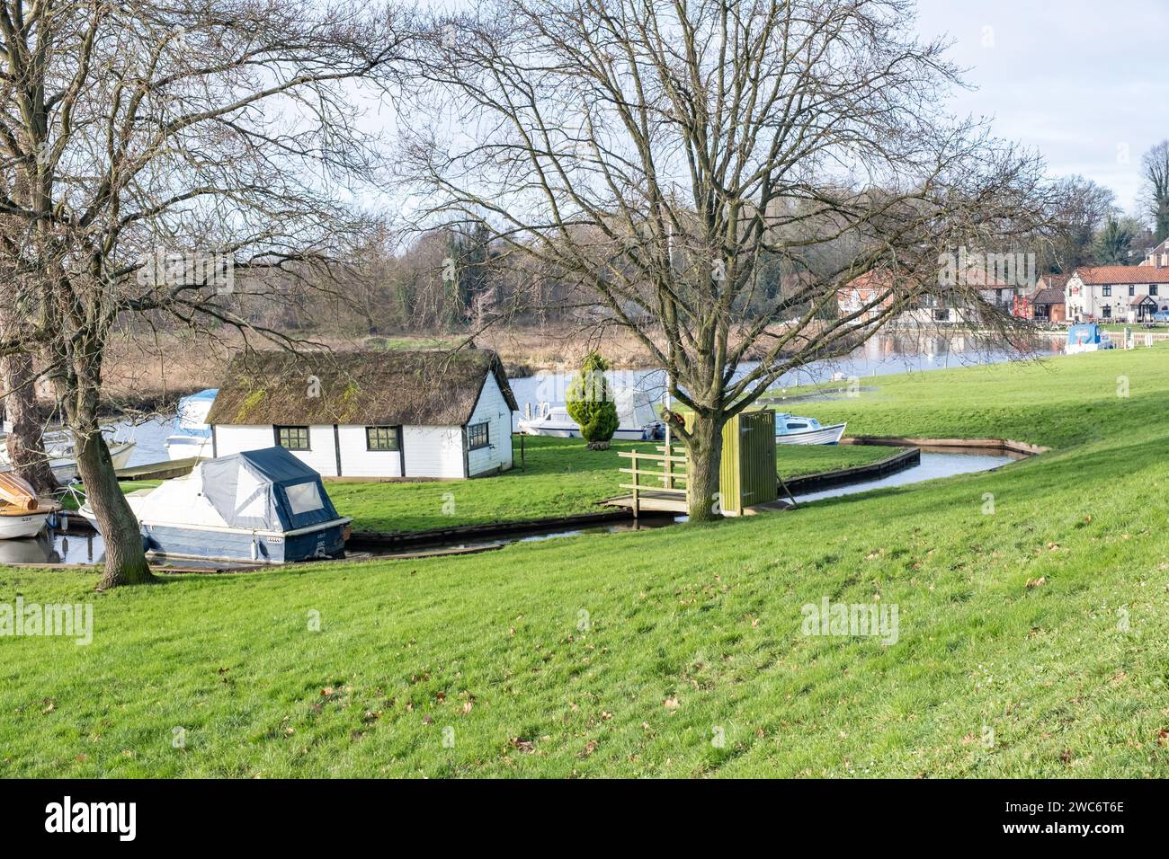 Coltishall, Norfolk, UK – January 13 2024. Boats moored near a wooden ...