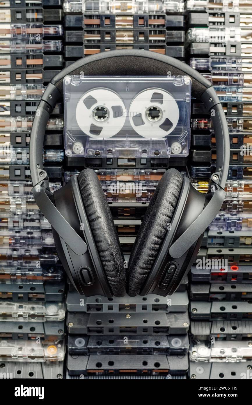 Retro compact cassette with rolls and headphones, vertical photo Stock ...