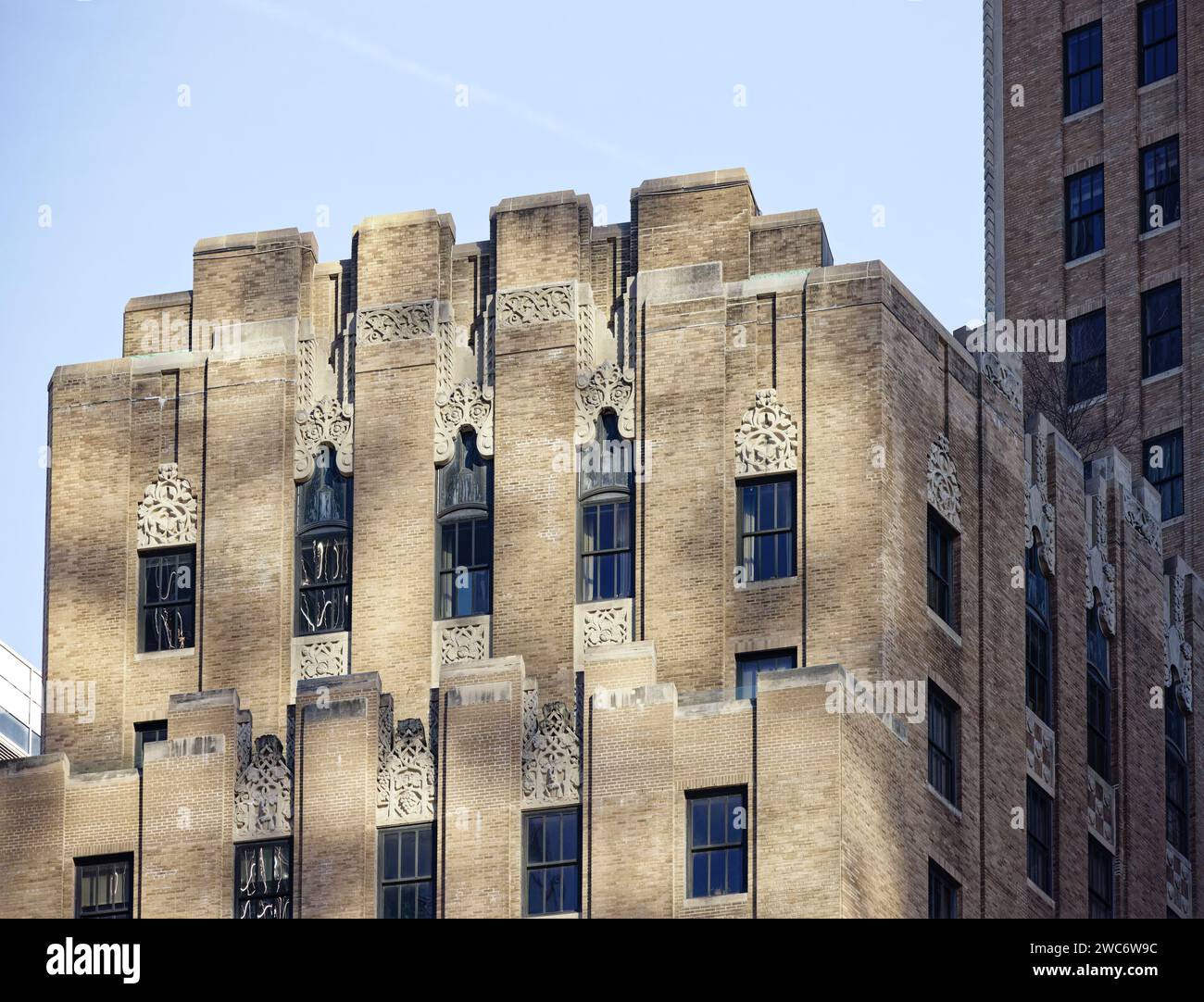 Barclay-Vesey Building’s polychrome brick façade is decorated in carved ...