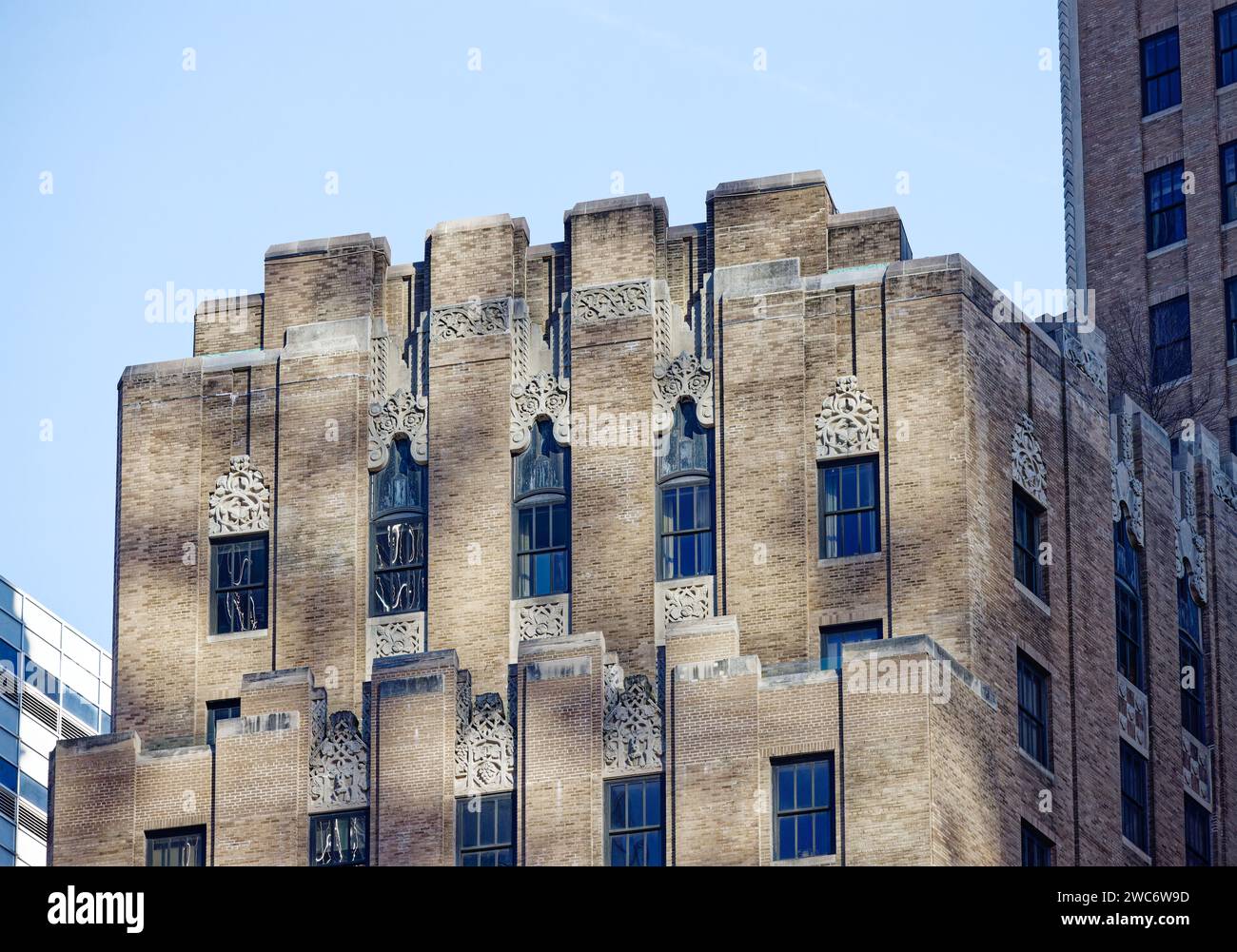 Barclay-Vesey Building’s polychrome brick façade is decorated in carved ...