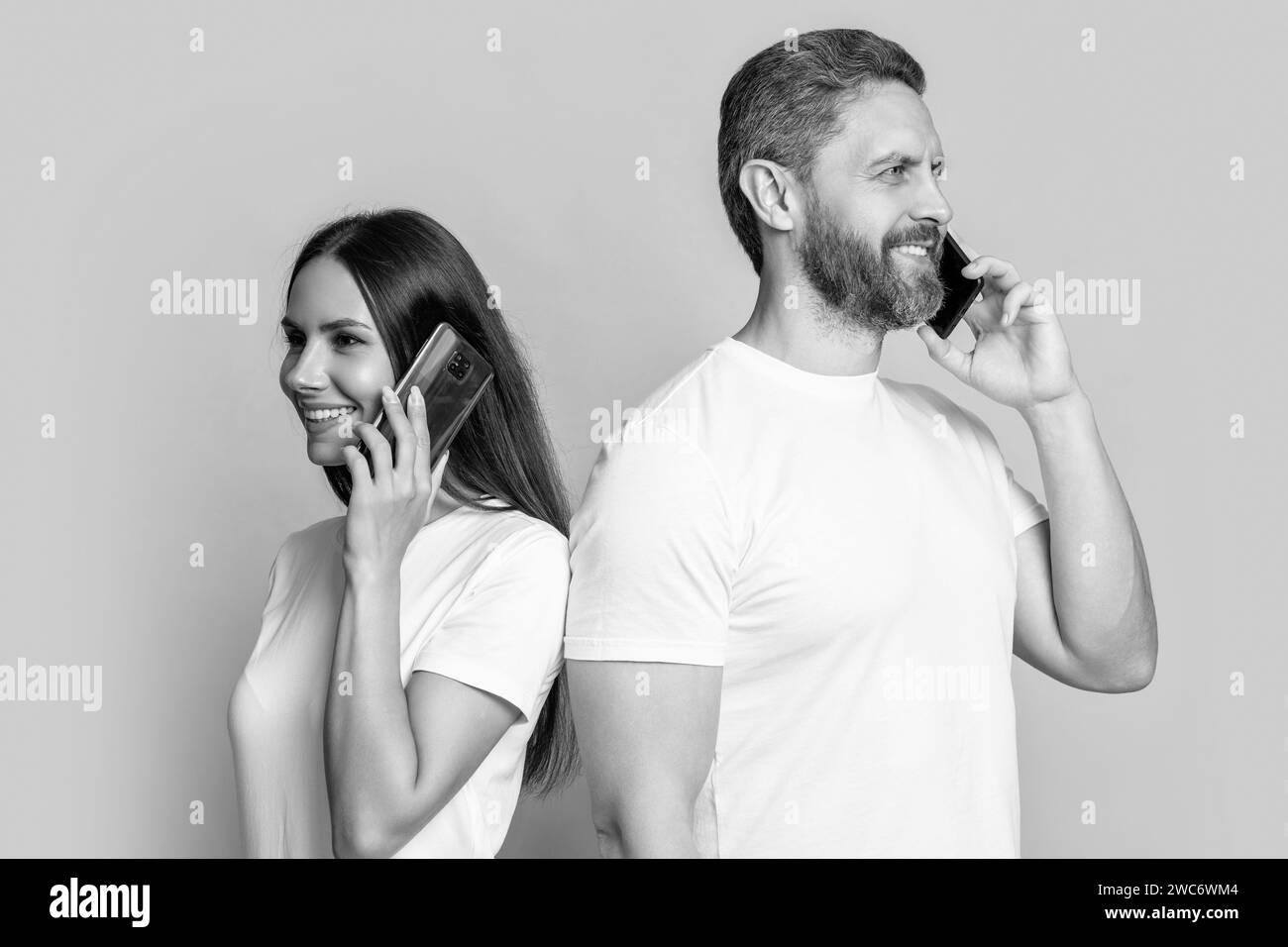 Mobile phone conversation of positive couple. Mobile communication of ...