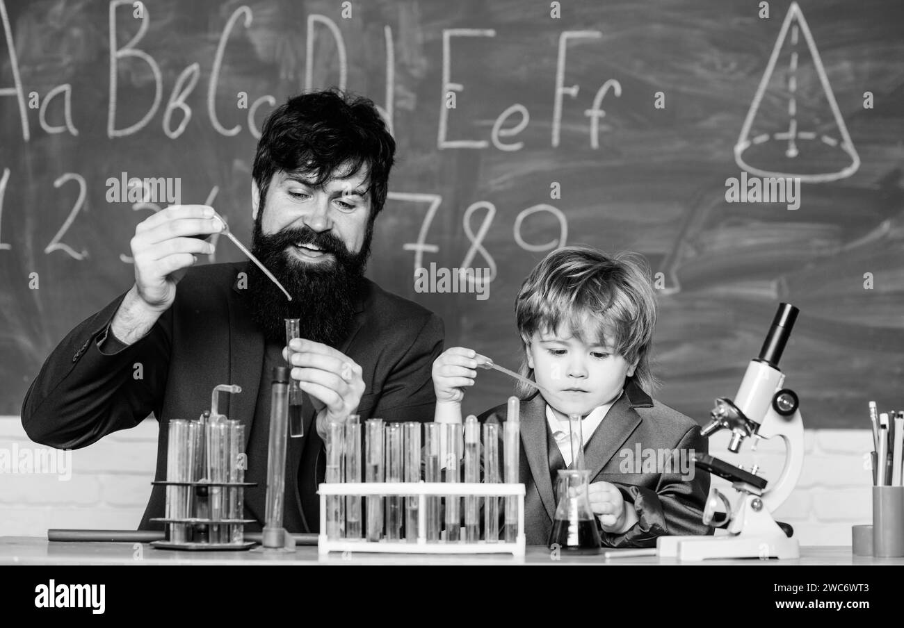 teacher man with little boy. Biology Science lab. Scientist research ...