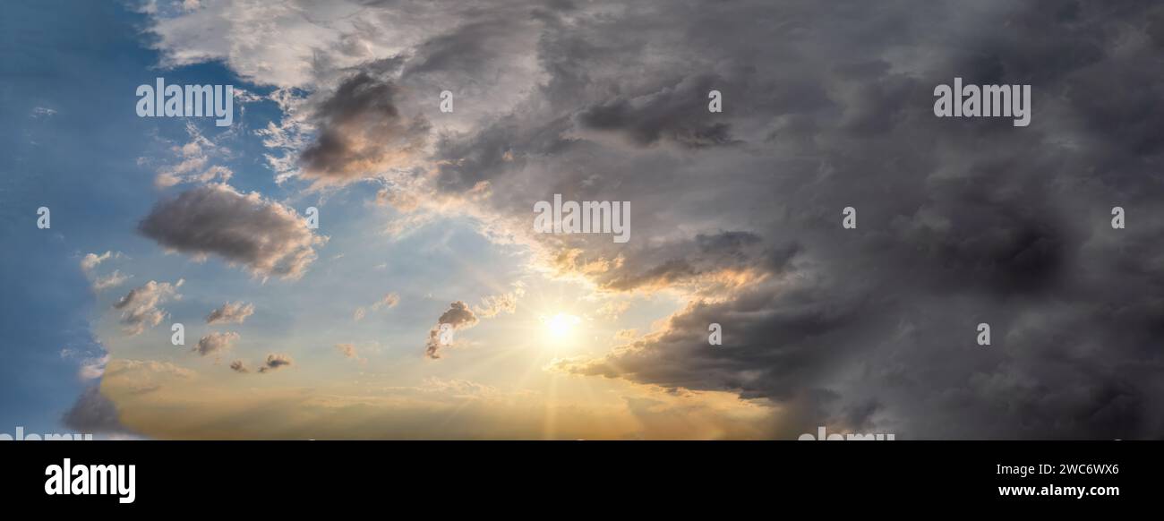 split sky between a storm and sunny day, at the edge of the rain cloud ...