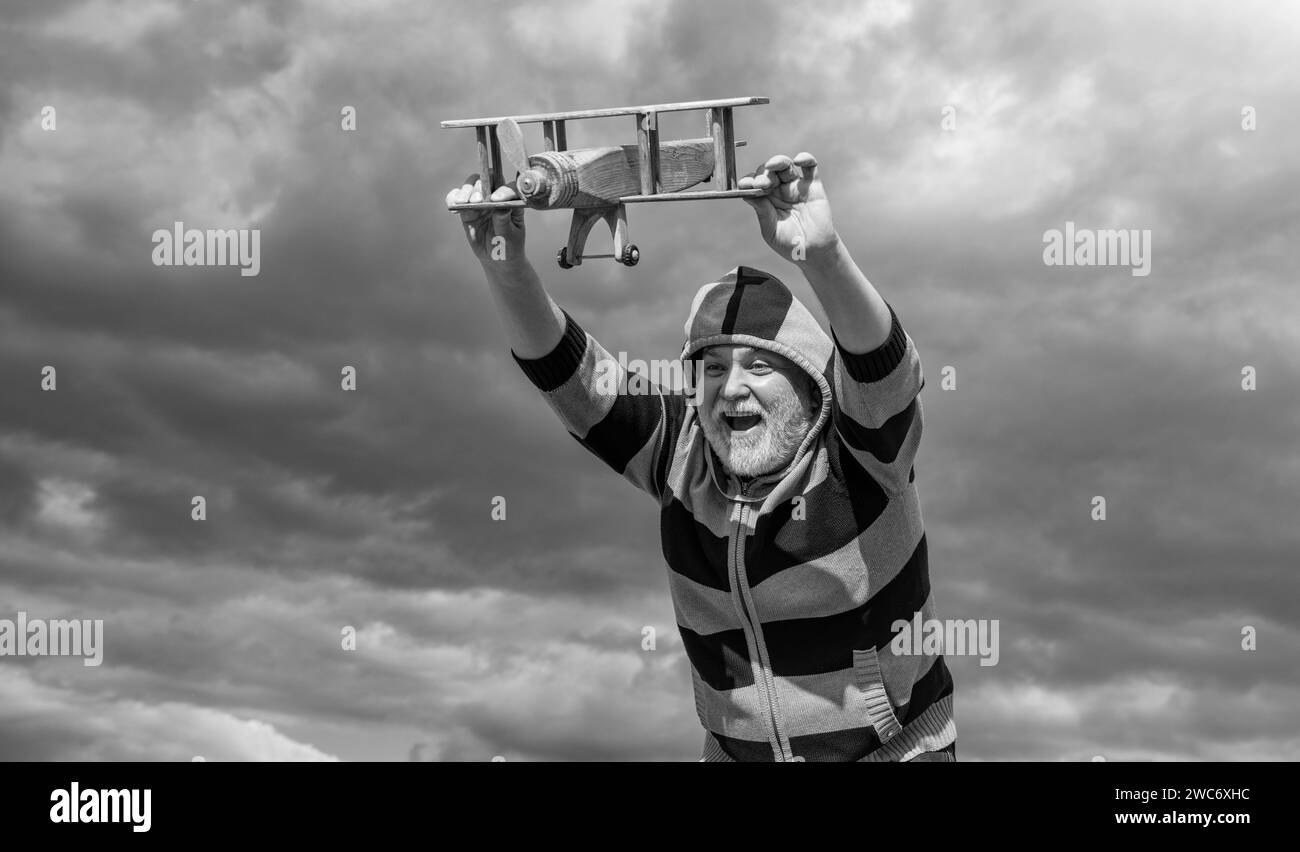 happy retirement. old age granddad with toy. retired old man outdoor ...