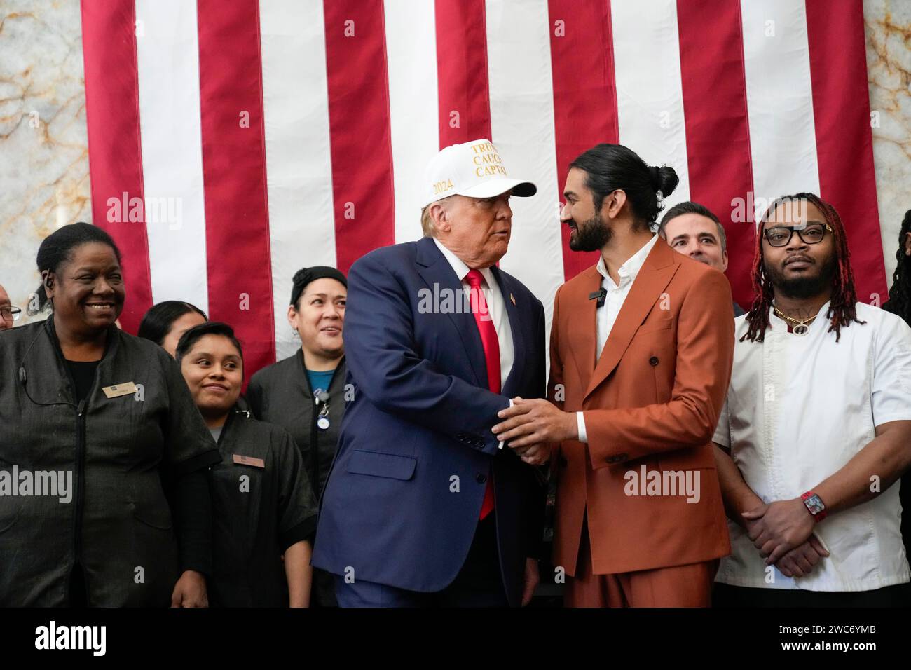 Republican presidential candidate former President Donald Trump shakes ...