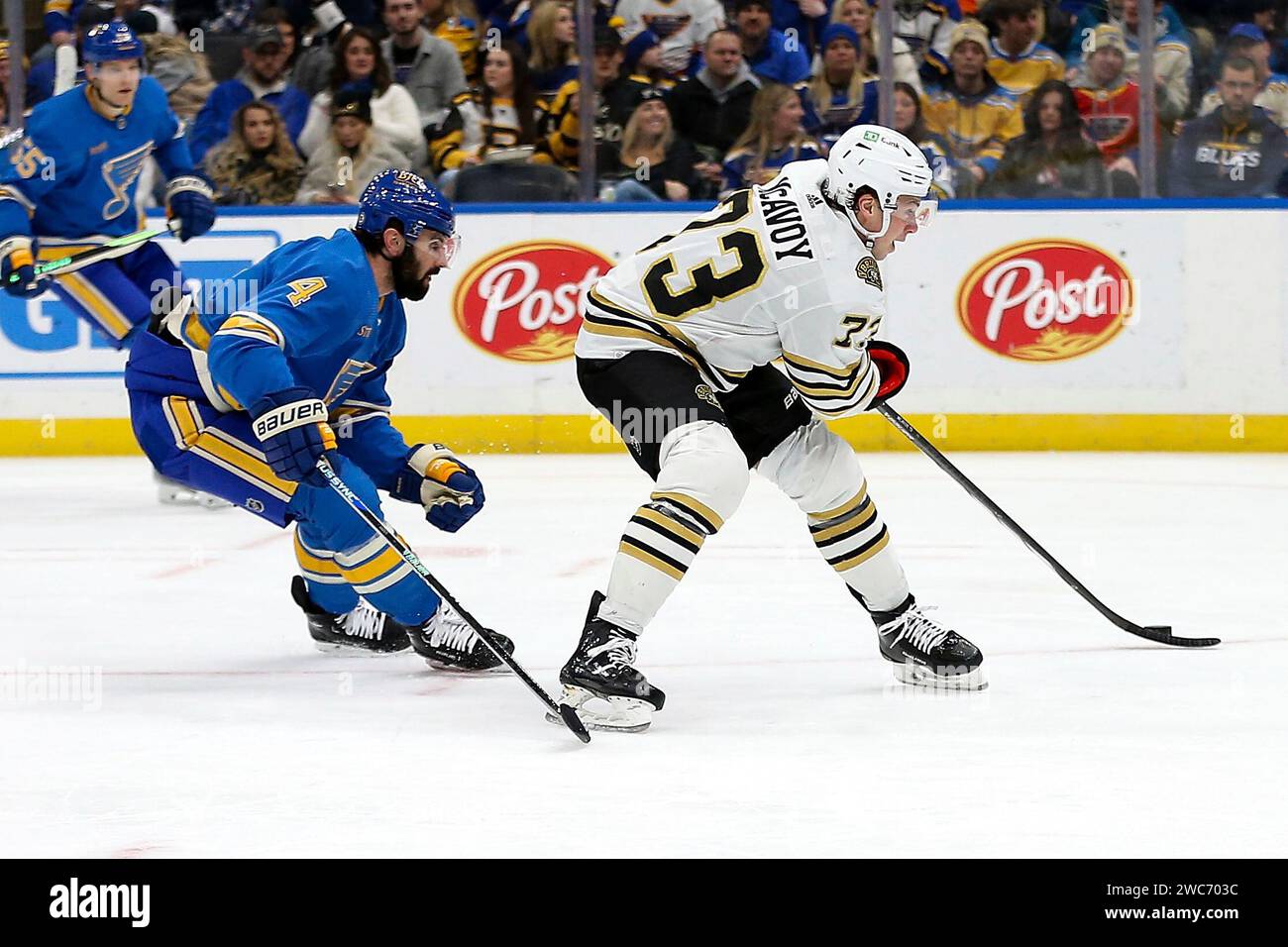 Boston Bruins' Charlie McAvoy (73) controls the puck ahead of St. Louis ...