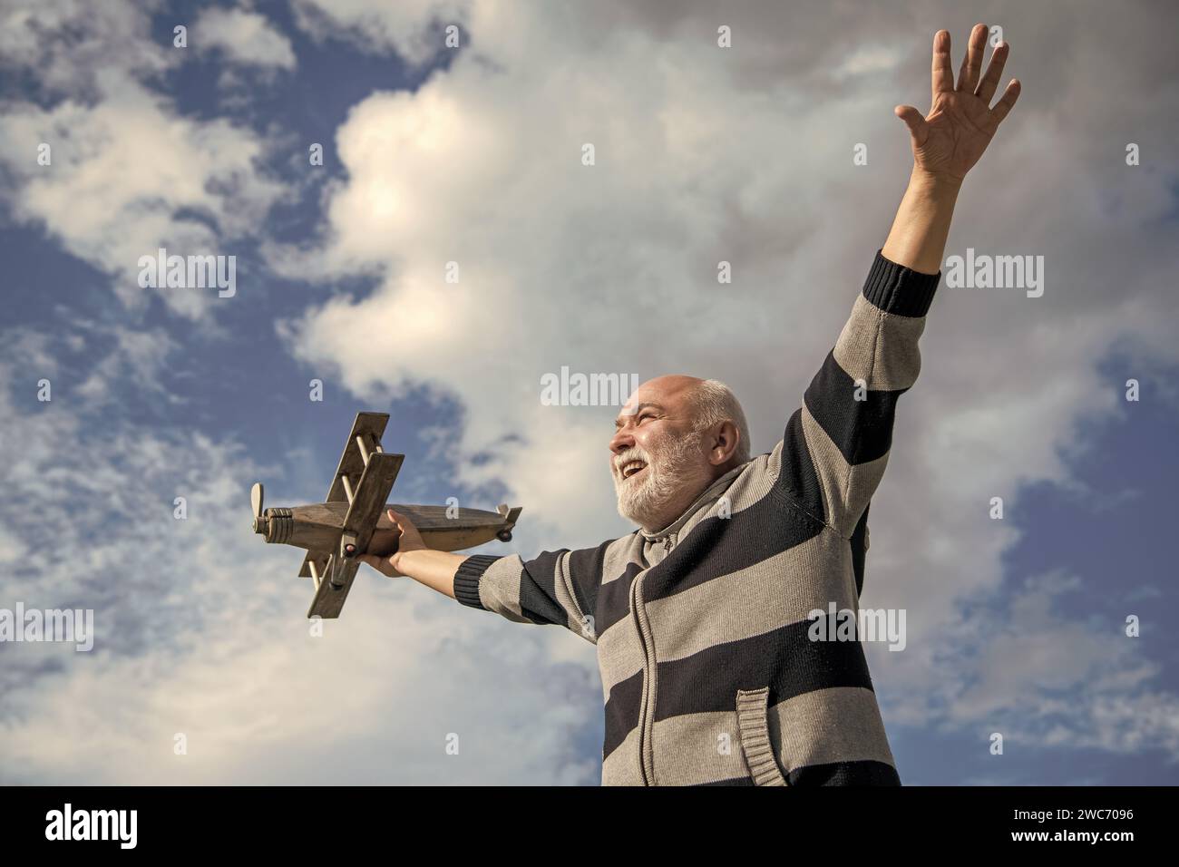 happy retirement. old granddad with toy. retired old man outdoor ...