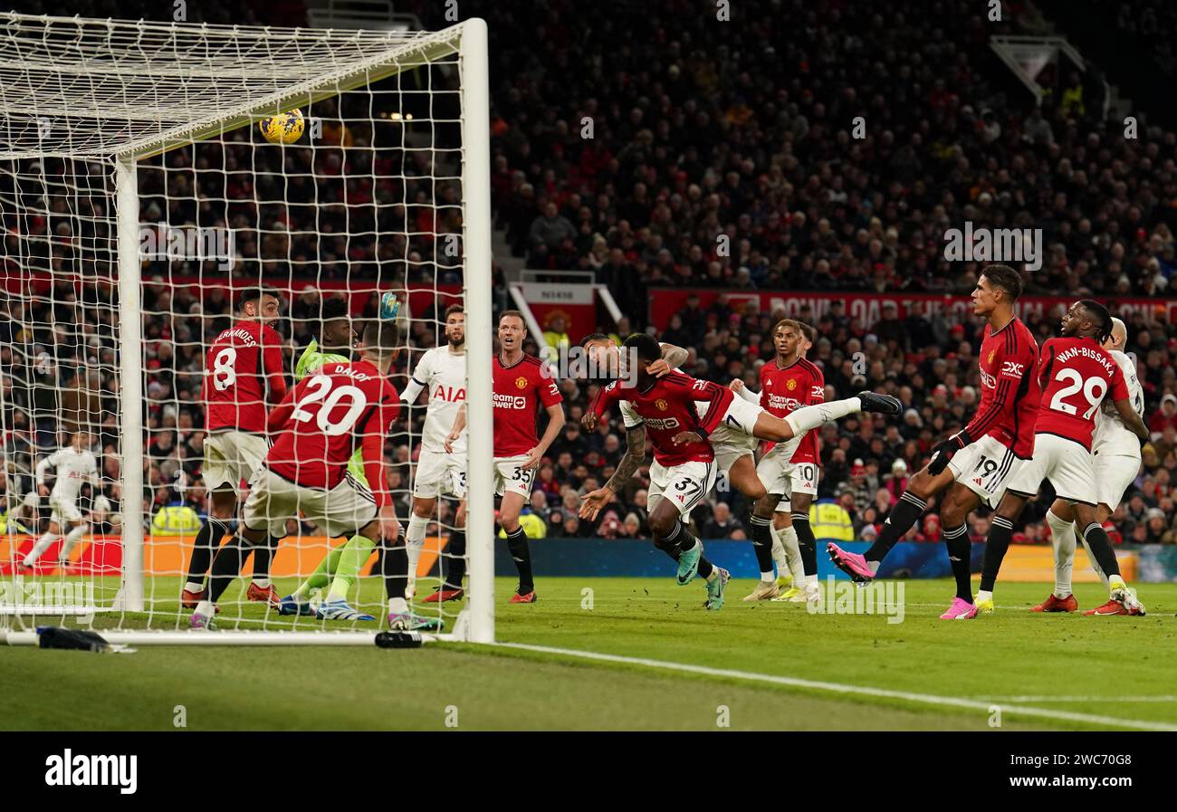 Tottenham Hotspur's Cristian Romero sees his header hit the bar during ...