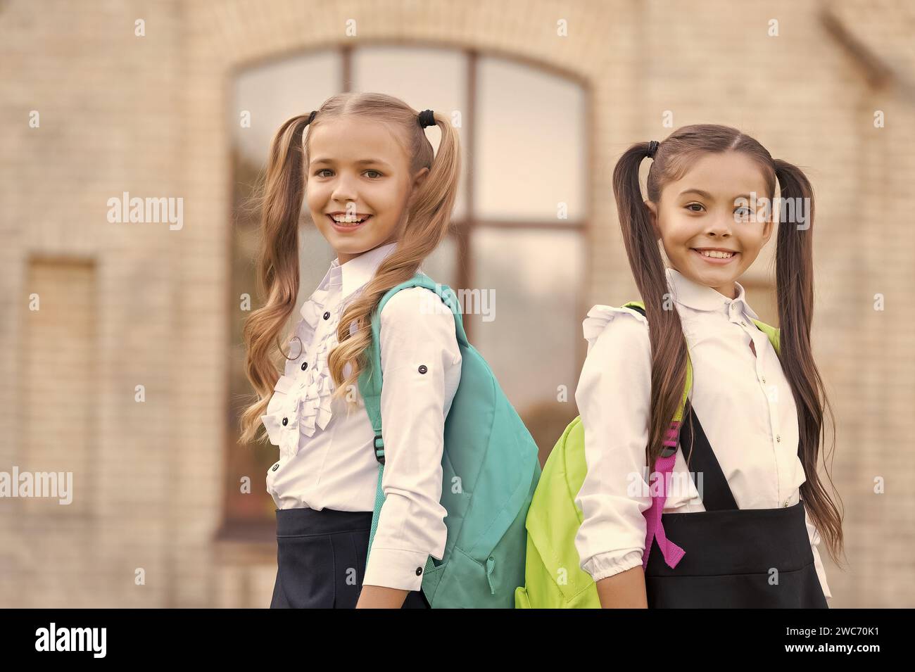 two school girls best friends smile together outdoor Stock Photo - Alamy