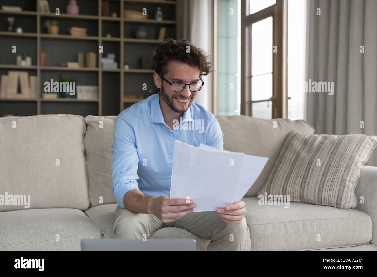 Happy man read received notification from bank with good news Stock ...