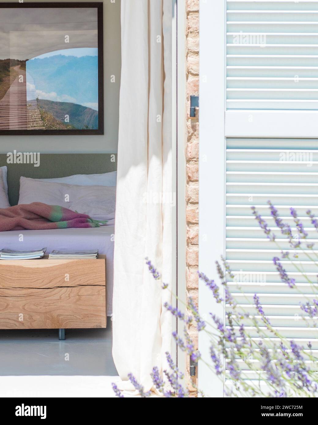 A tranquil scene featuring a person reclining on a comfortable bed ...