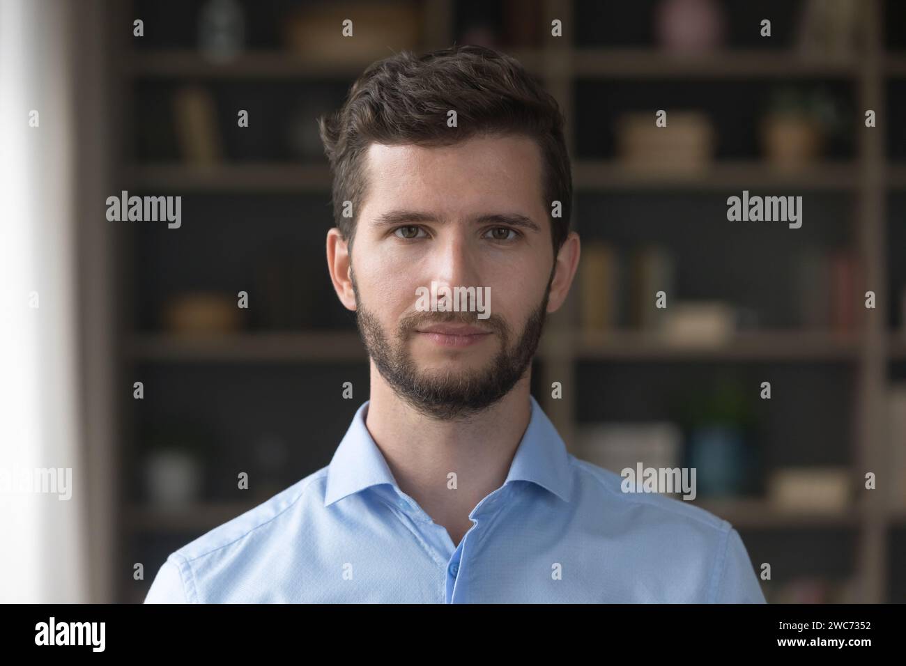 Headshot portrait millennial bearded guy staring at camera Stock Photo - Alamy