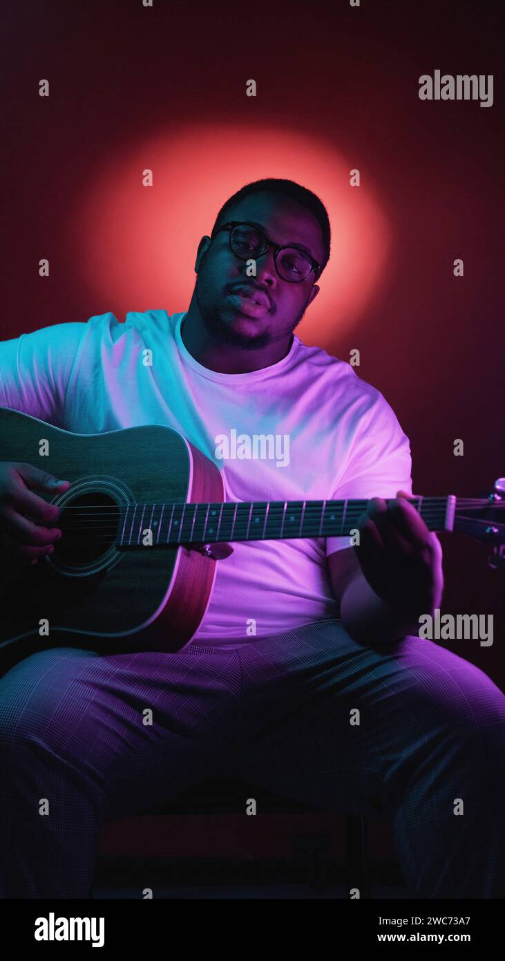 Man performing with guitar hi-res stock photography and images - Alamy