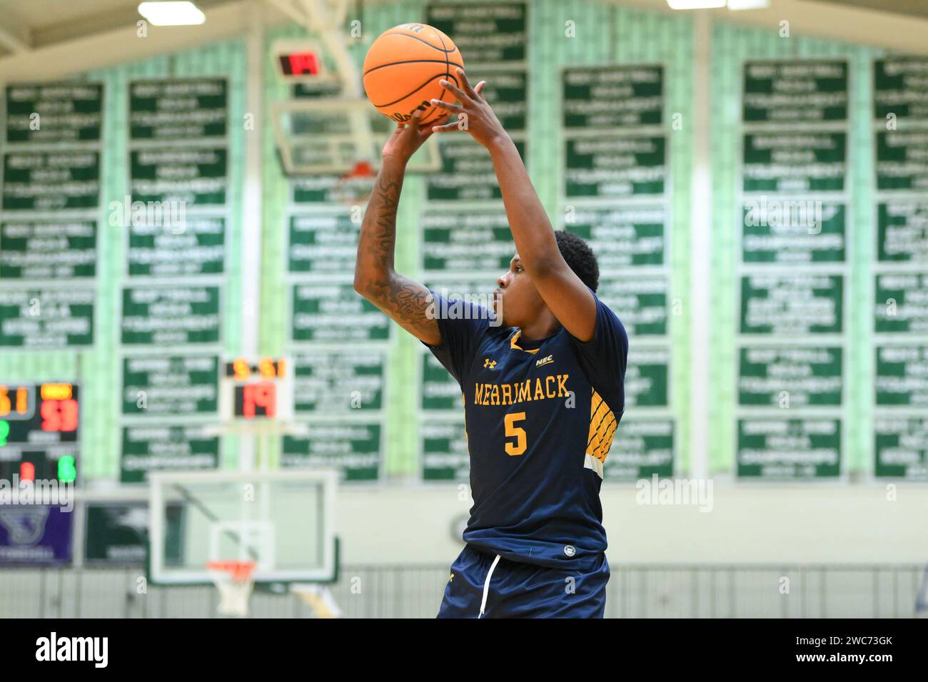 Syracuse, NY, USA. 13th Jan, 2024. Merrimack Warriors guard Devon Savage (5) shoots the ball ...