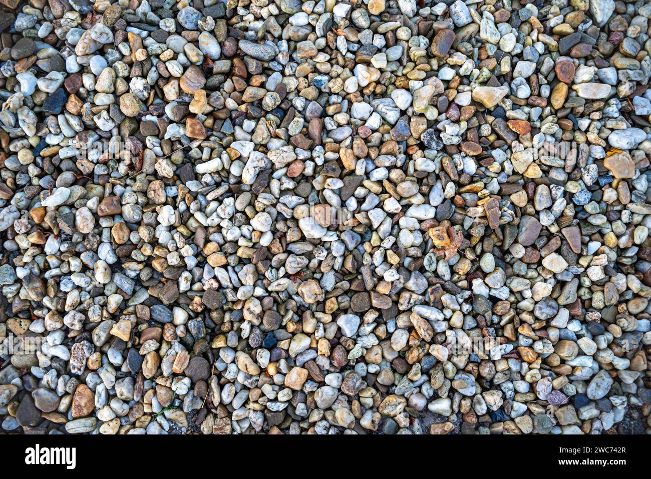 A close-up view of loose gravel scattered on the ground surface Stock ...