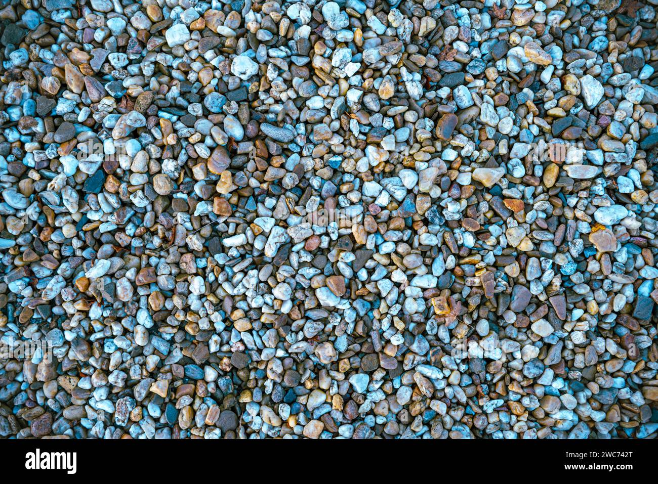 A bird's-eye view of a stack of rocks arranged neatly on the earth's ...
