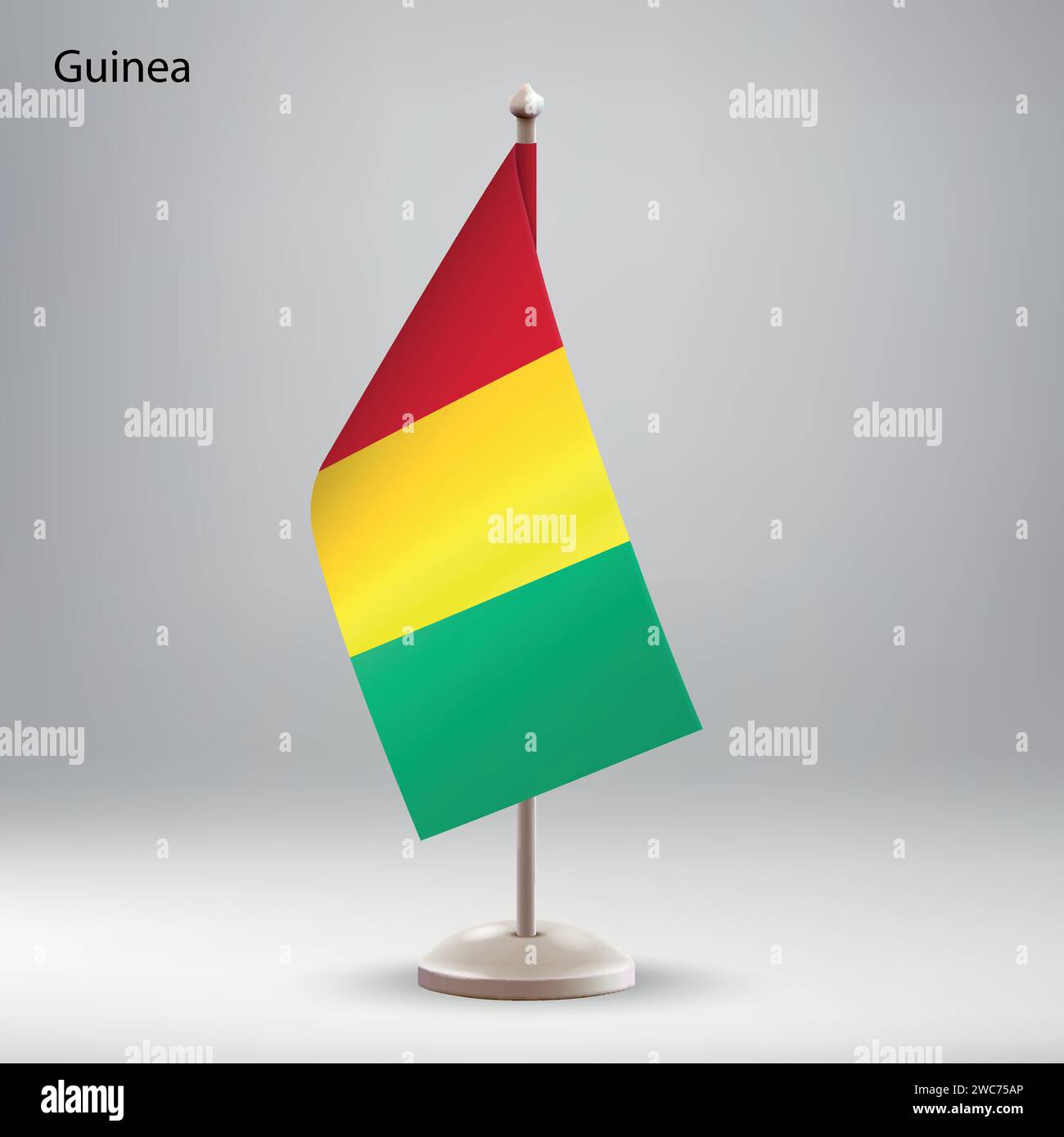 Flag of Guinea hanging on a flag stand. Usable for summit or conference ...