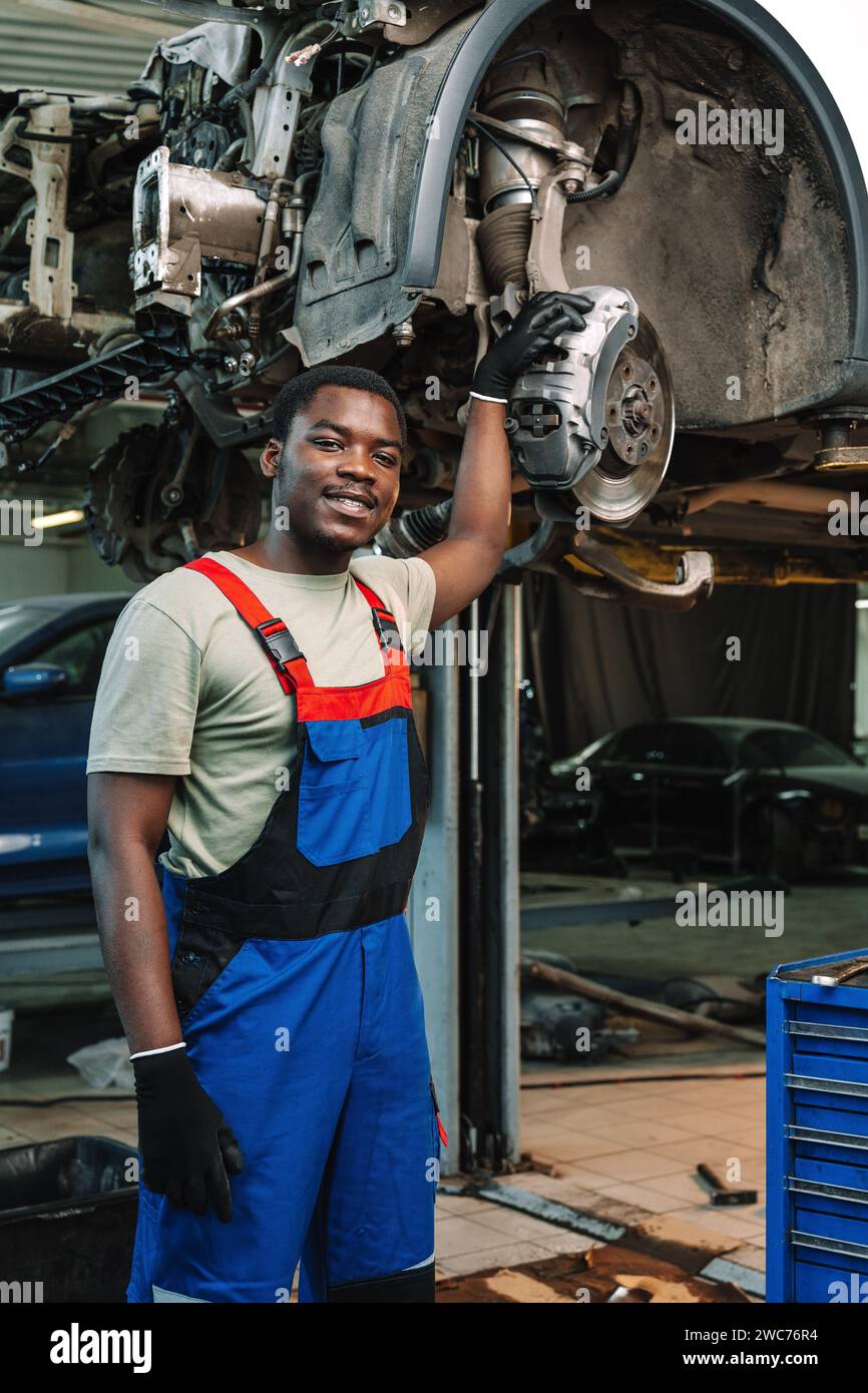 Black male mechanic standing hi-res stock photography and images - Alamy