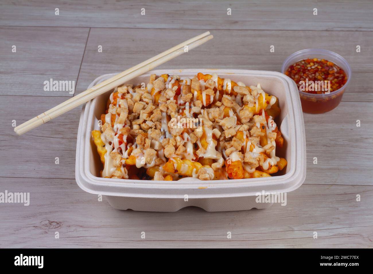 Japanese Poke Chicken Fries in a container with chopsticks Stock Photo ...