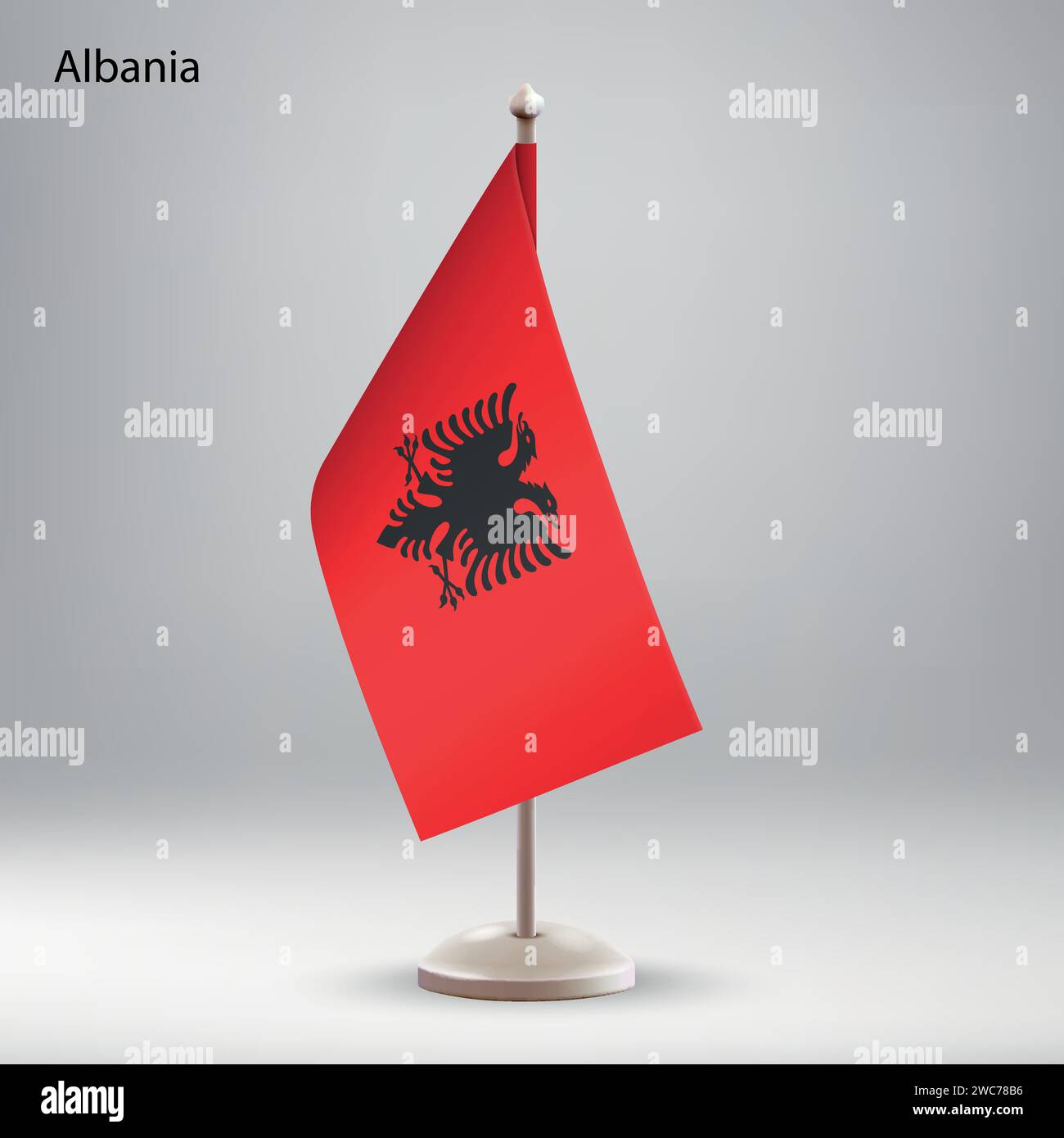 Flag of Albania hanging on a flag stand. Usable for summit or ...
