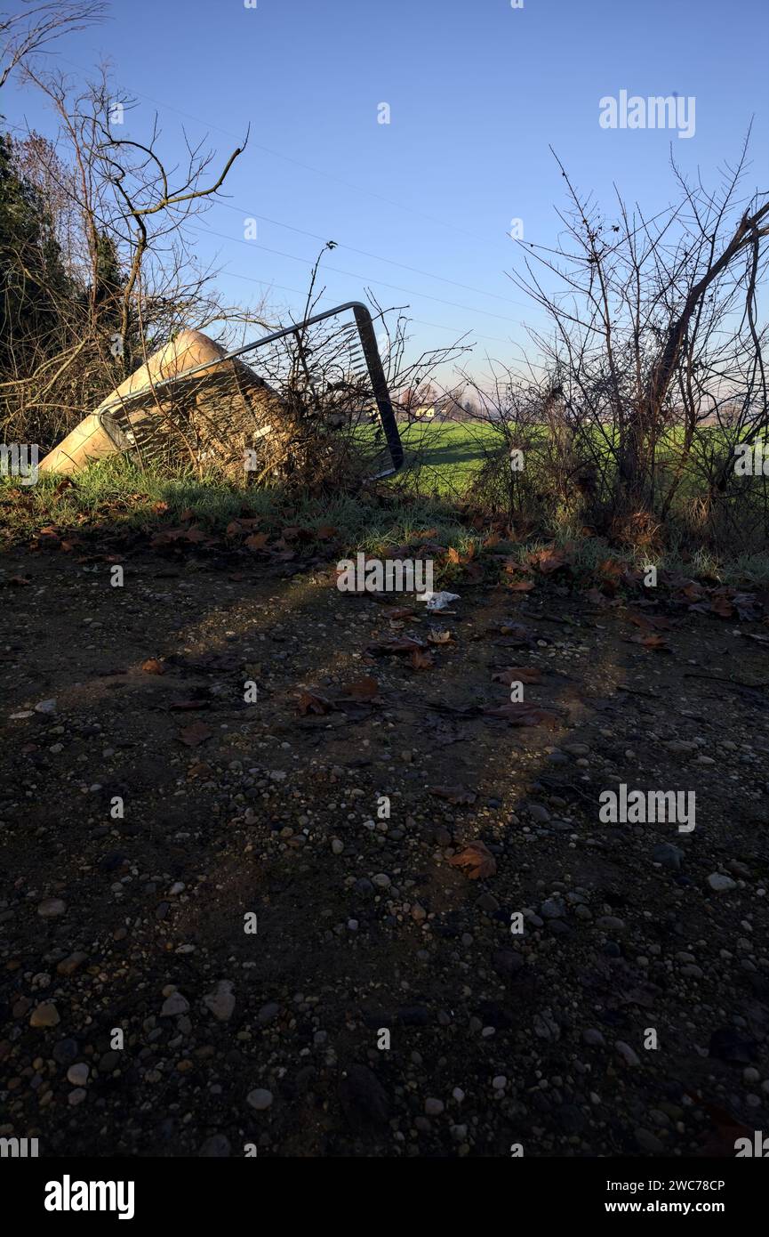 Garbage by the edge of a path Stock Photo - Alamy