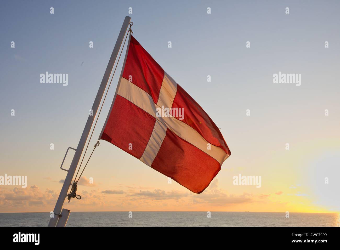 The flag of Denmark waves over the North Sea Stock Photo - Alamy