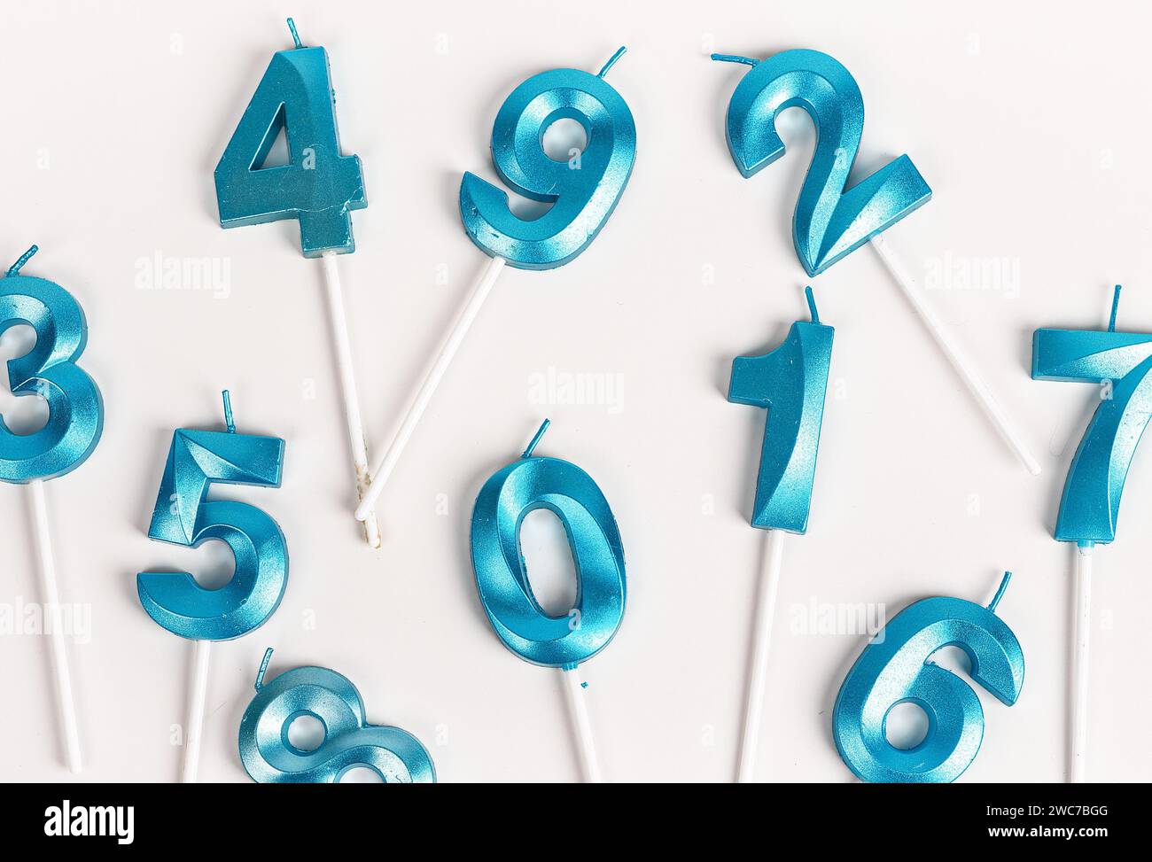 Birthday number candles, wax cake decorations scattered around Stock ...