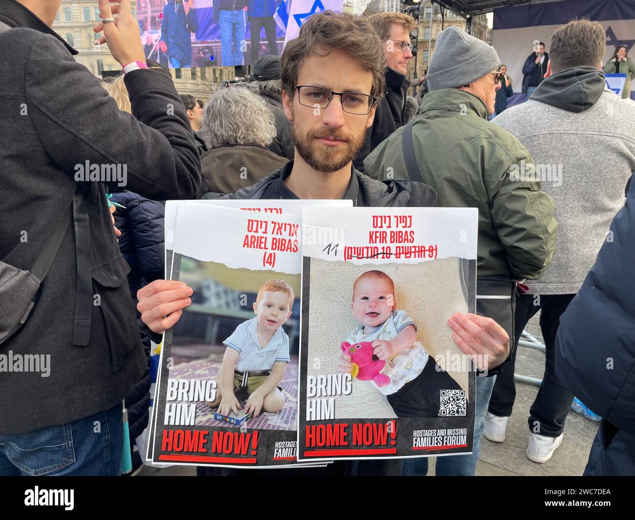30-year-old Eylon Keshet holding a photo of his cousin's children who ...