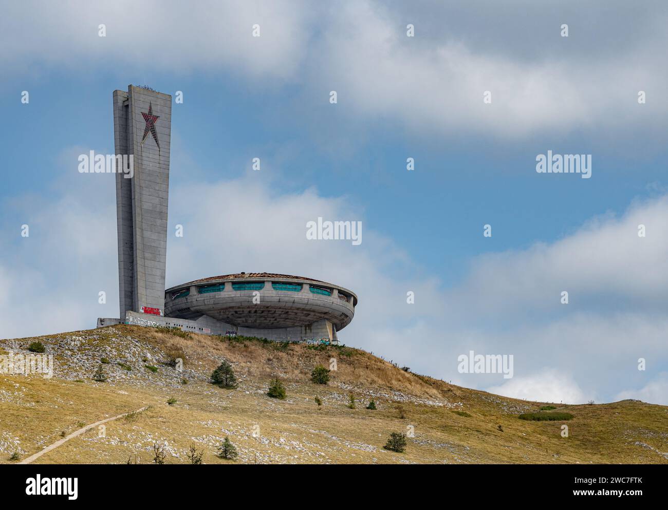A majestic skyscraper adorned with a prominent star crowns the summit ...