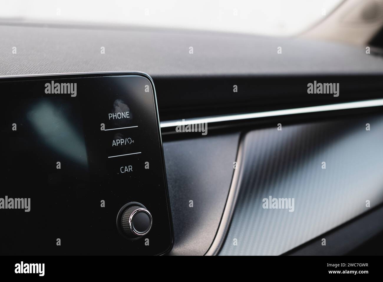 Many fingerprints on a touchable infotainment black screen interior car ...