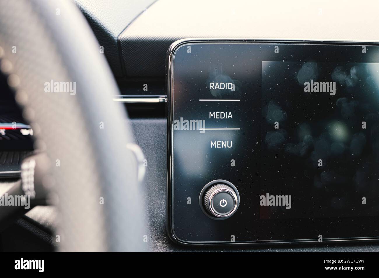 Many fingerprints on a touchable infotainment black screen interior car ...
