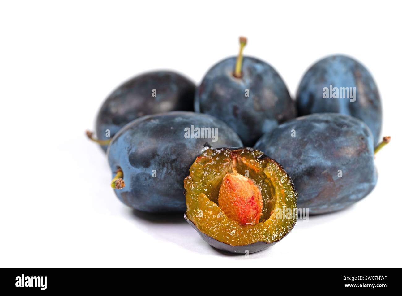 Ripe plums isolated against white background Stock Photo - Alamy