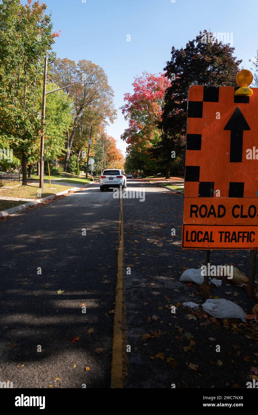 SUV drives down a closed road under construction Stock Photo - Alamy