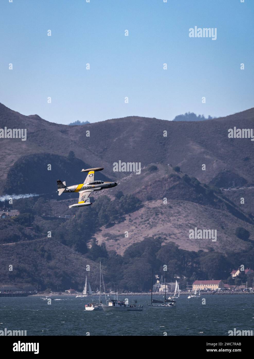 A T-33 vintage jet flying in San Francisco during an airshow by the ...