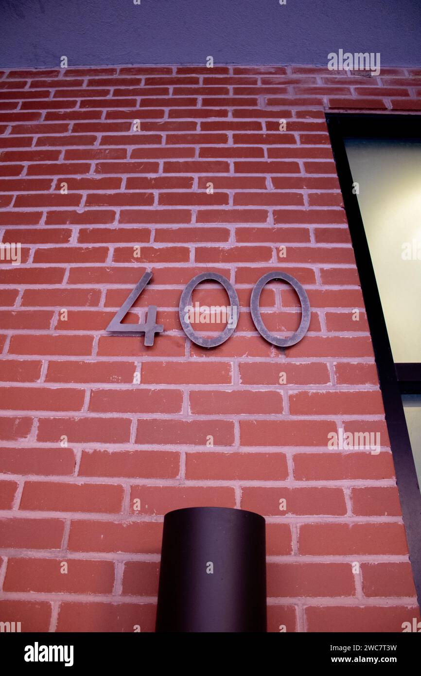 A close-up photograph of a city building wall featuring a prominent ...