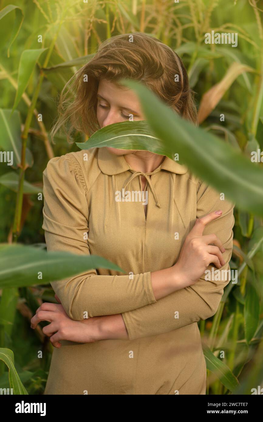 Portrait of stylish model girl in corn field on a sunny day ...
