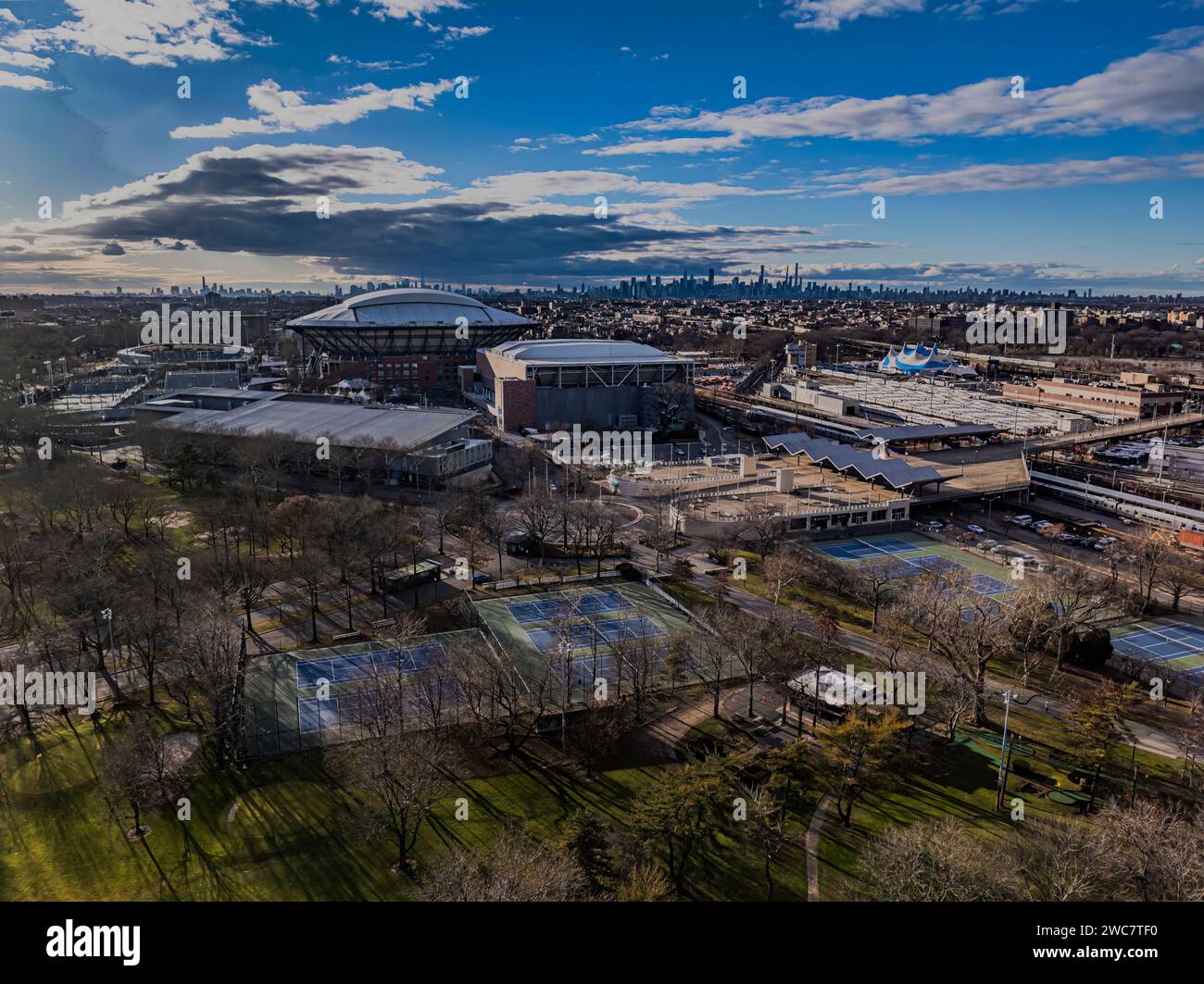 A low altitude, aerial view of Arthur Ashe Stadium in Queens, NY on a ...