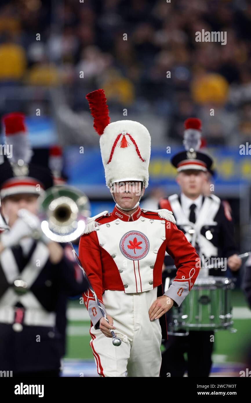 The Drum Major for The Ohio State University Marching Band performs at the Cotton Bowl between ...