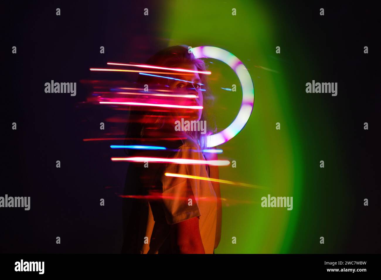 Dynamic portrait of woman dancing in mixed neon stage light. Concept of ...
