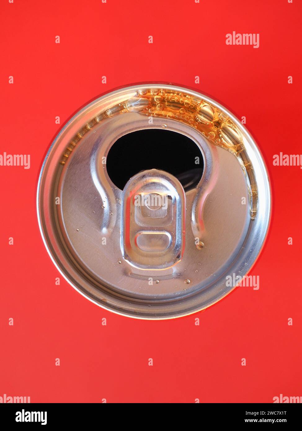 Cola Tin Can Over A Red Background Stock Photo - Alamy