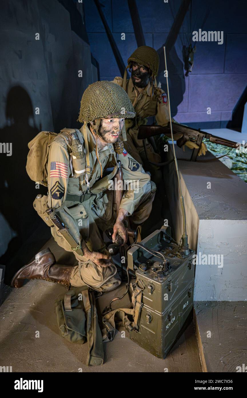 two American airborne soldiers covered behind a wall at night, soldier ...