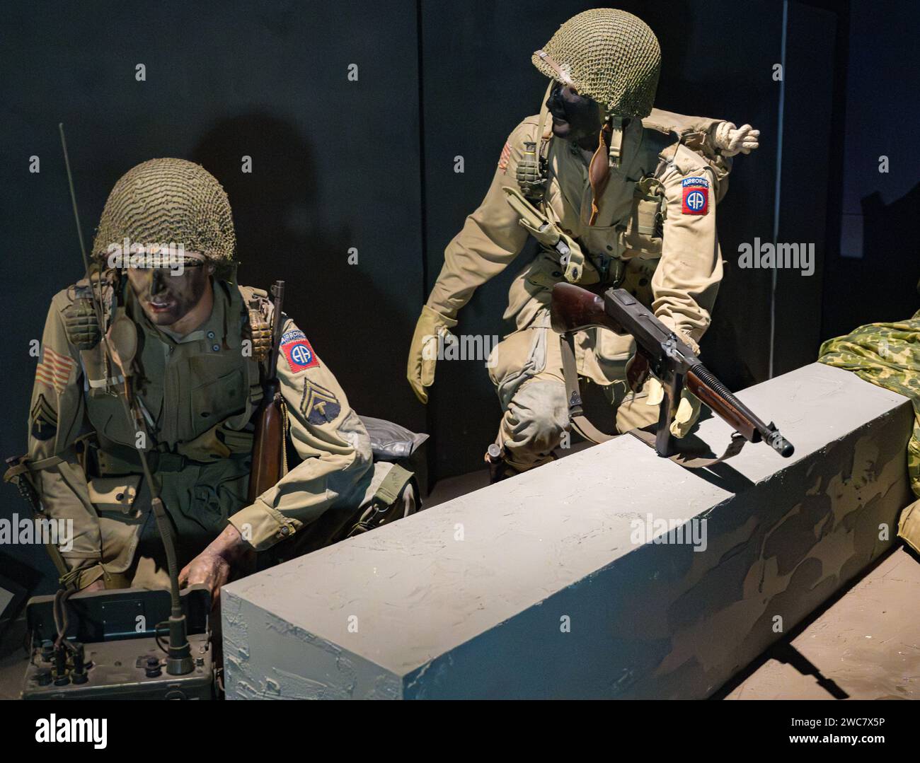 Detail of two American airbone soldiers entrenched behind a wall in ...