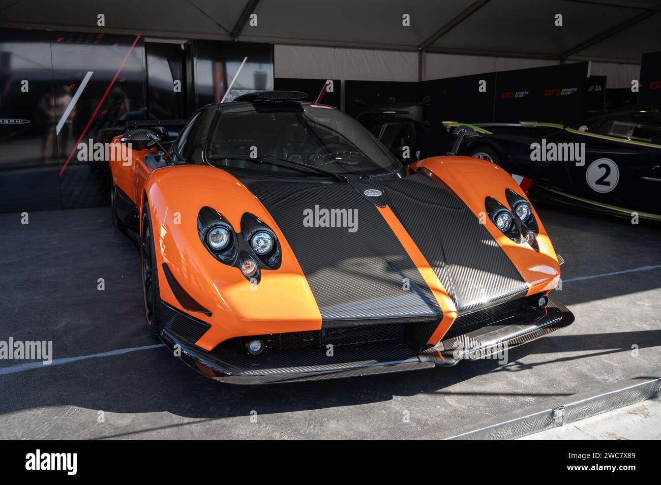 Front view of a stunning orange Pagani Zonada Cinque GT1 with black ...