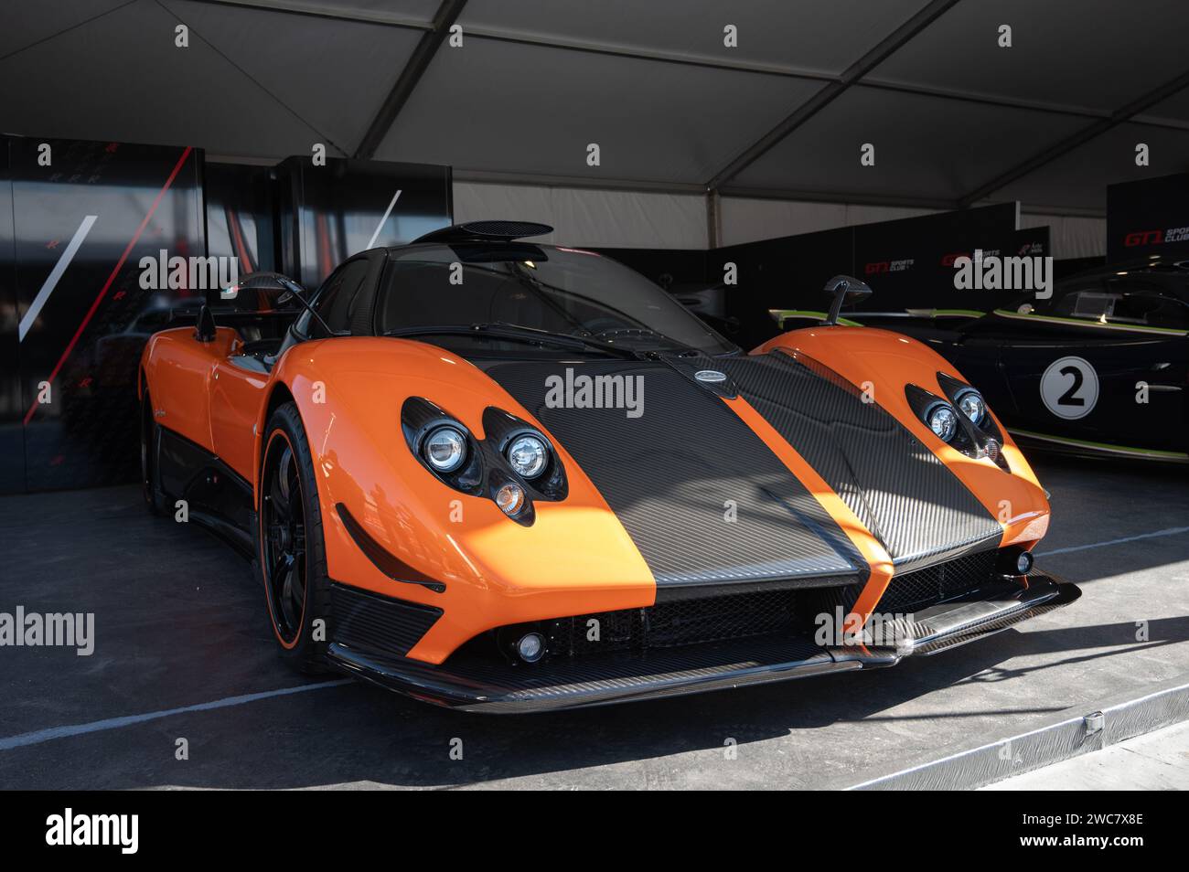 Front view of a stunning orange Pagani Zonada Cinque GT1 with black ...
