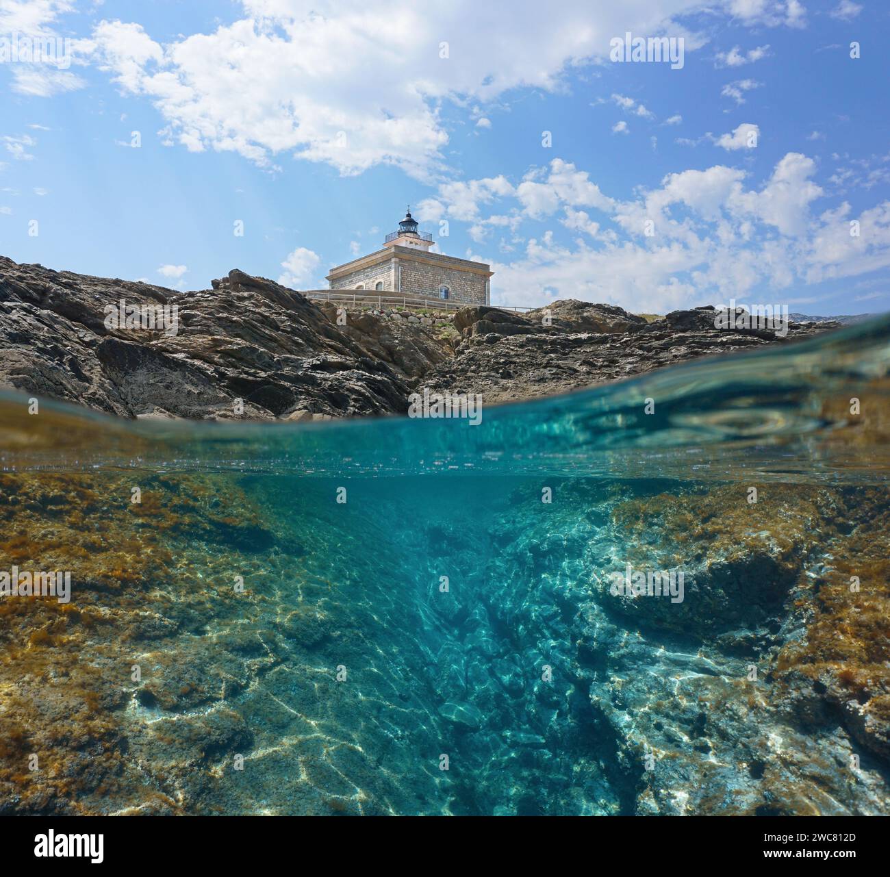 Lighthouse on rocky shore water hi-res stock photography and images - Alamy