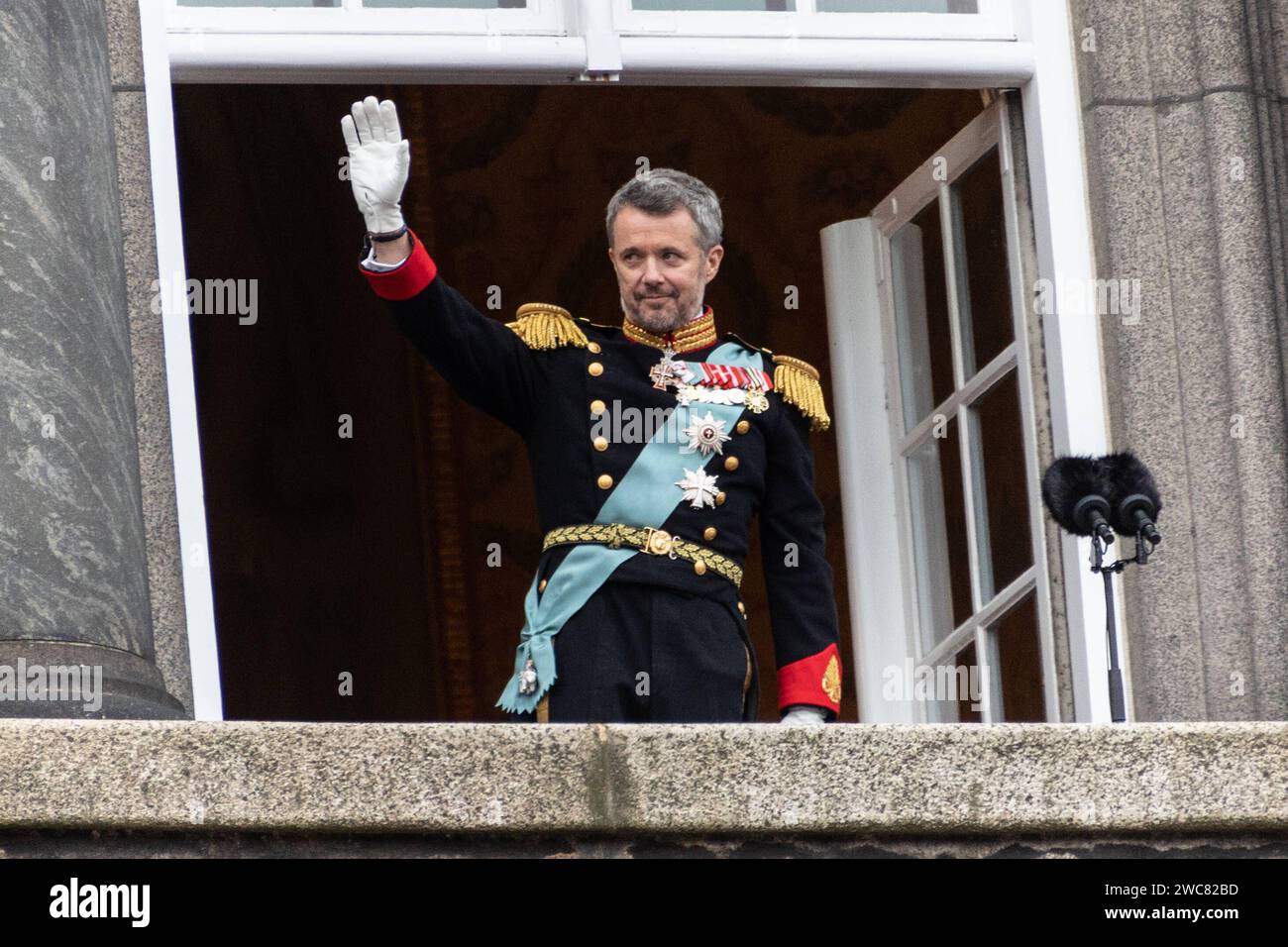 Denmark s King Frederik X waves from the balcony after the proclamation ...
